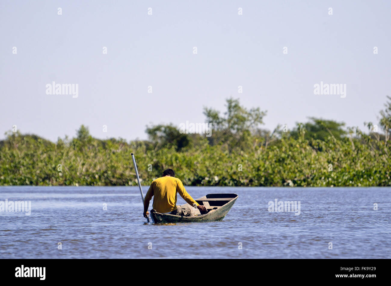 Canoeist on the waters of the Paraguay River looking place for fishing ...