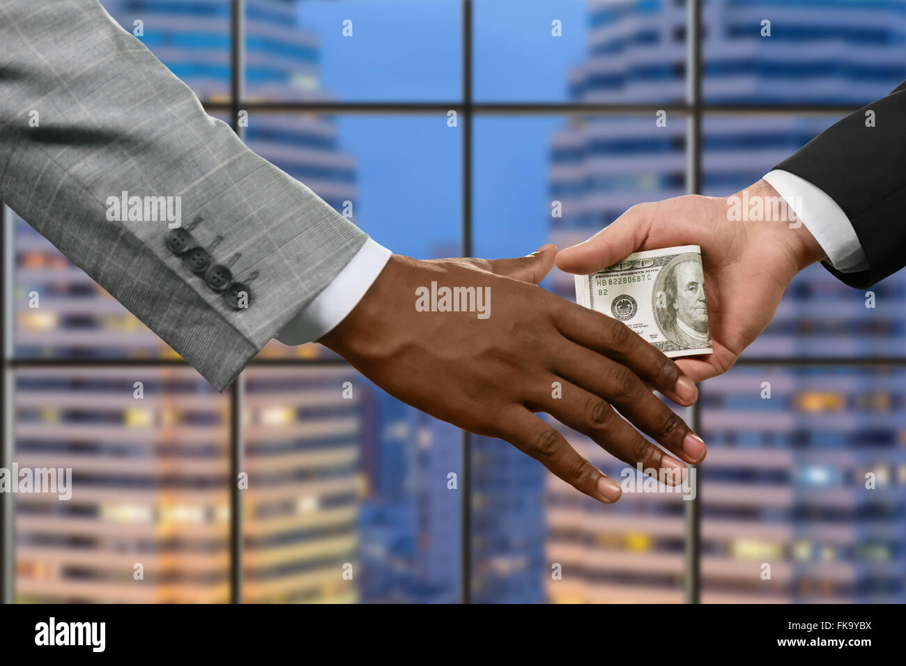 Manager handing money near window Stock Photo - Alamy