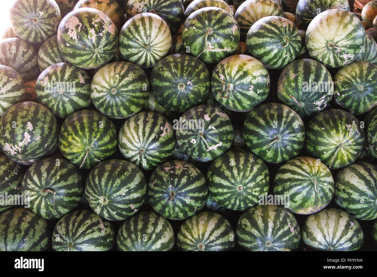 Watermelons piled on fruit stall Stock Photo - Alamy