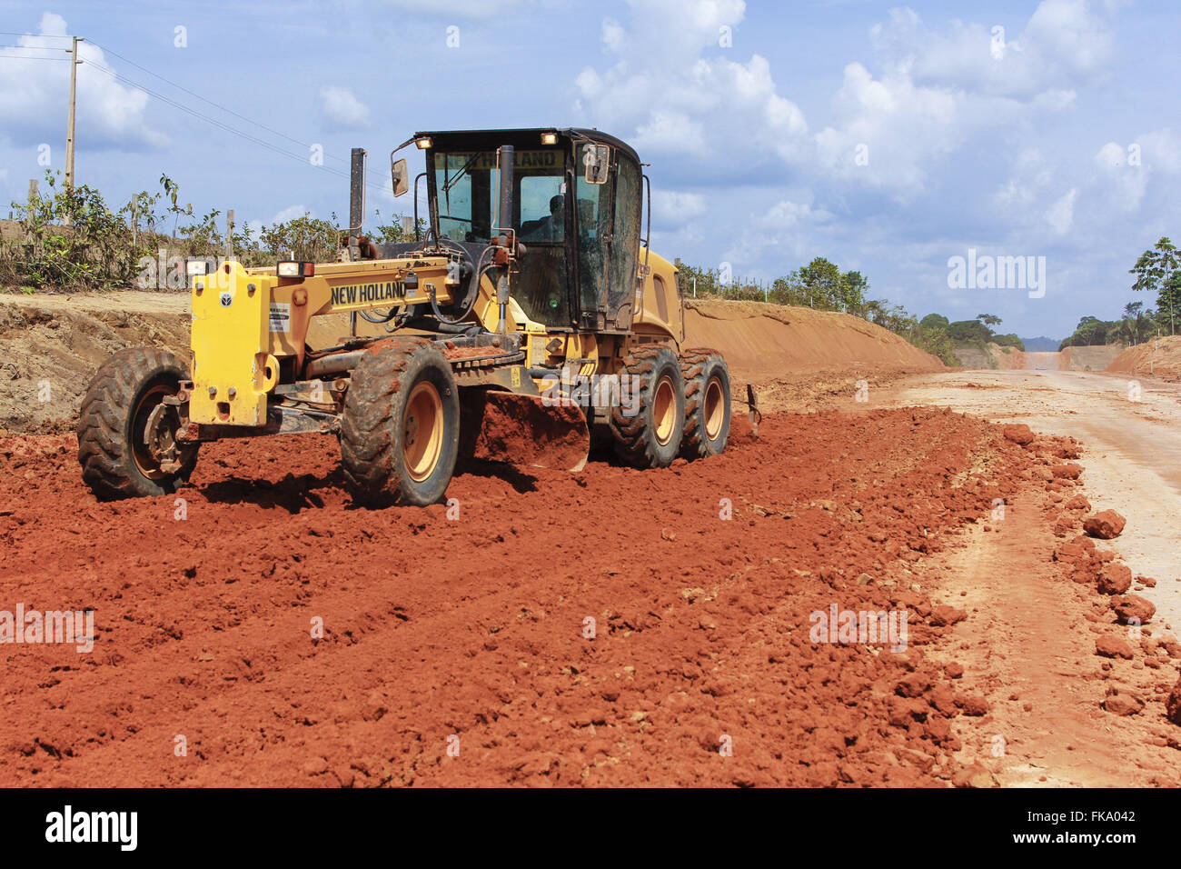 Earthmoving grader doing the works of Cuiaba Santarem highway BR-163 ...