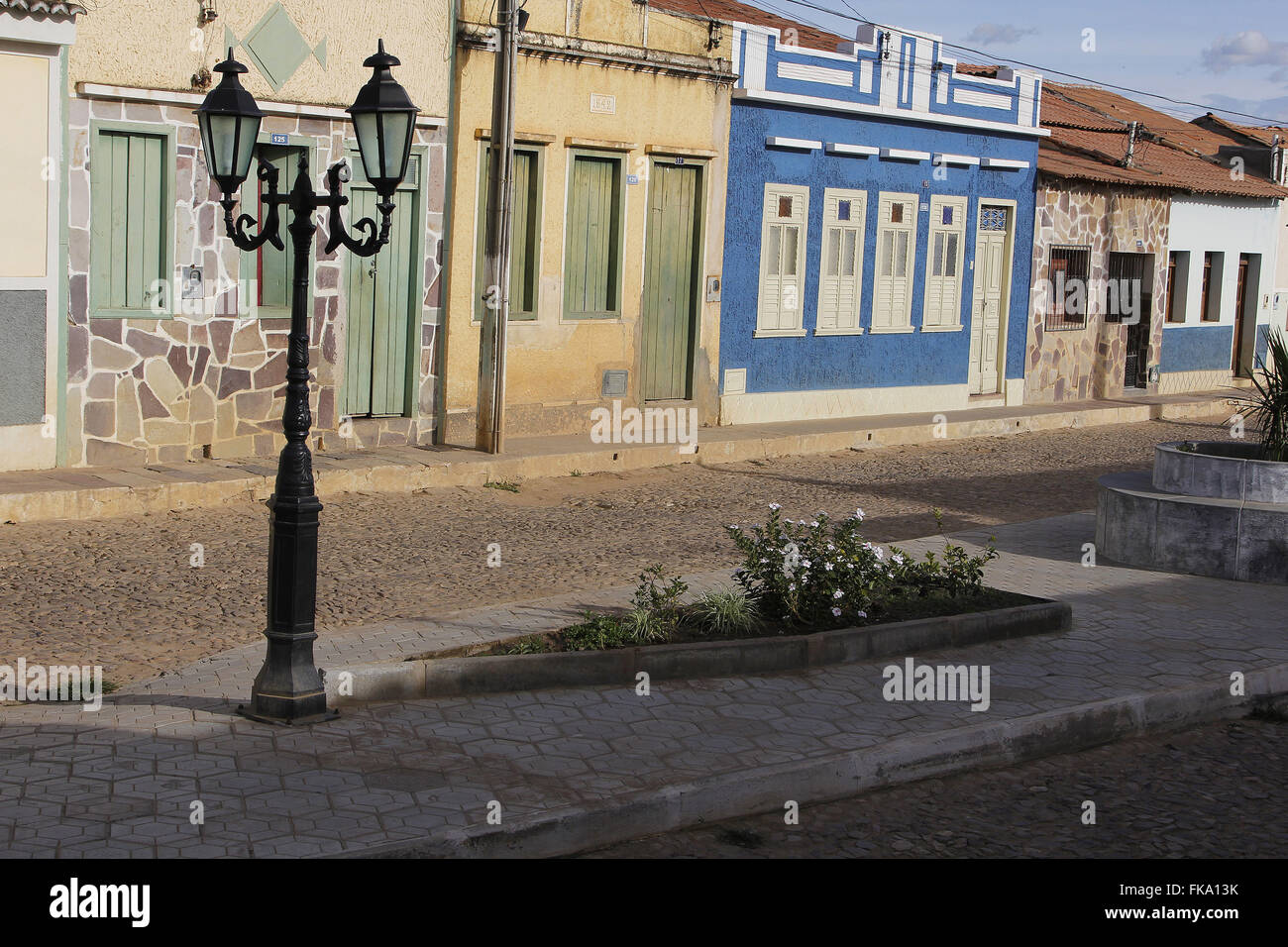 Luminaria and fronted houses in colonial style city street Stock Photo ...