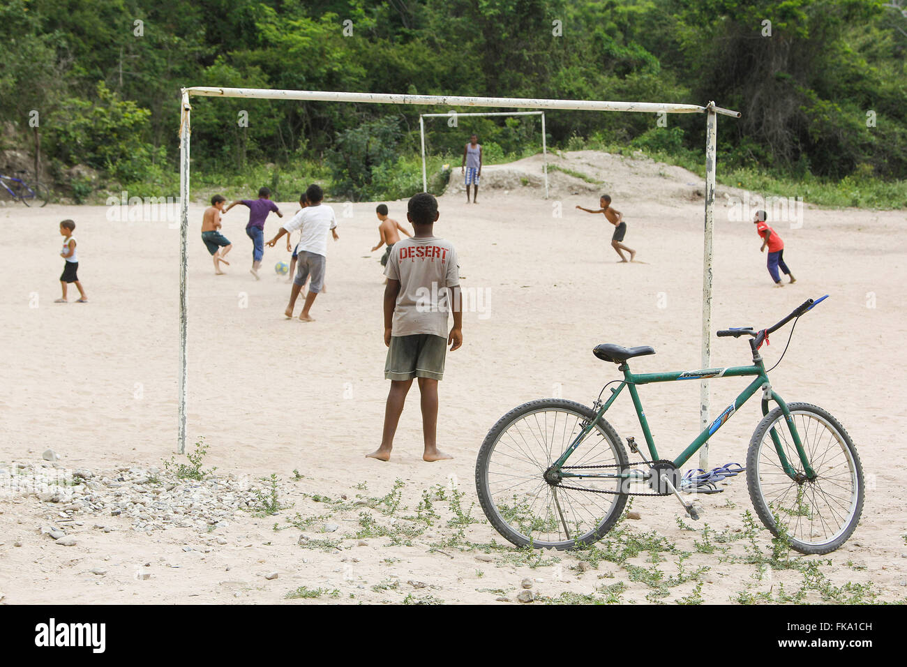 Children playing soccer in field hi-res stock photography and images ...