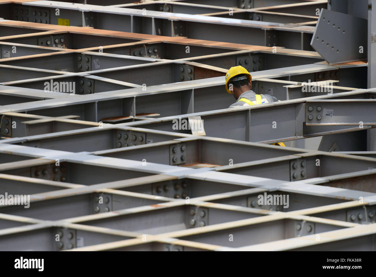 Laborer in the structure of the pipe work of construction of ...