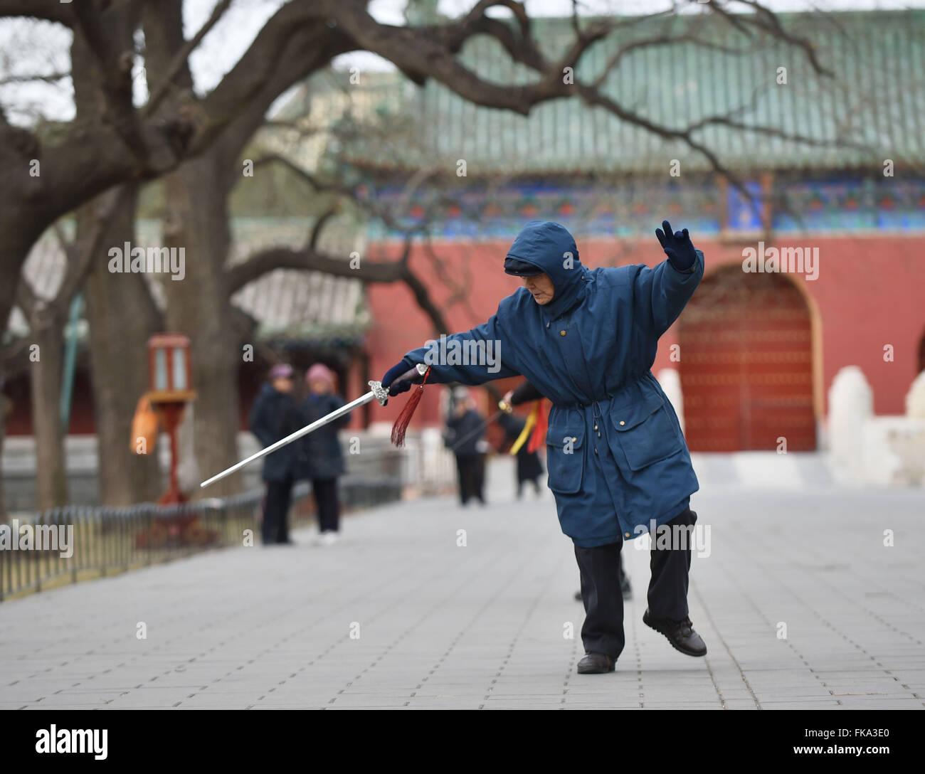 Beijing, China. 8th Mar, 2016. A resident wearing a thick coat does ...