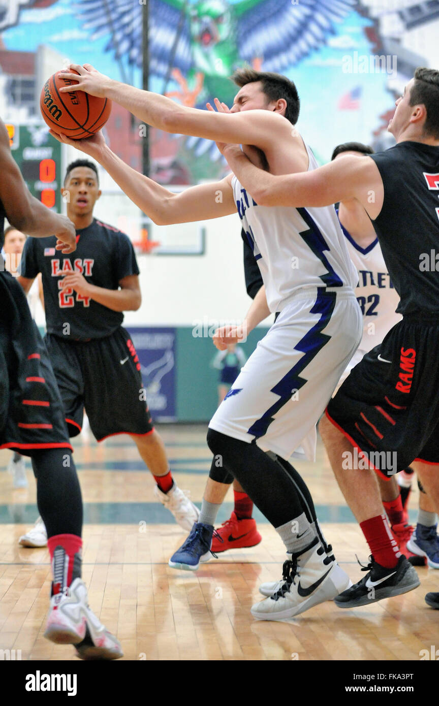 Player seizes a rebound and receives a hand to his face for his effort ...