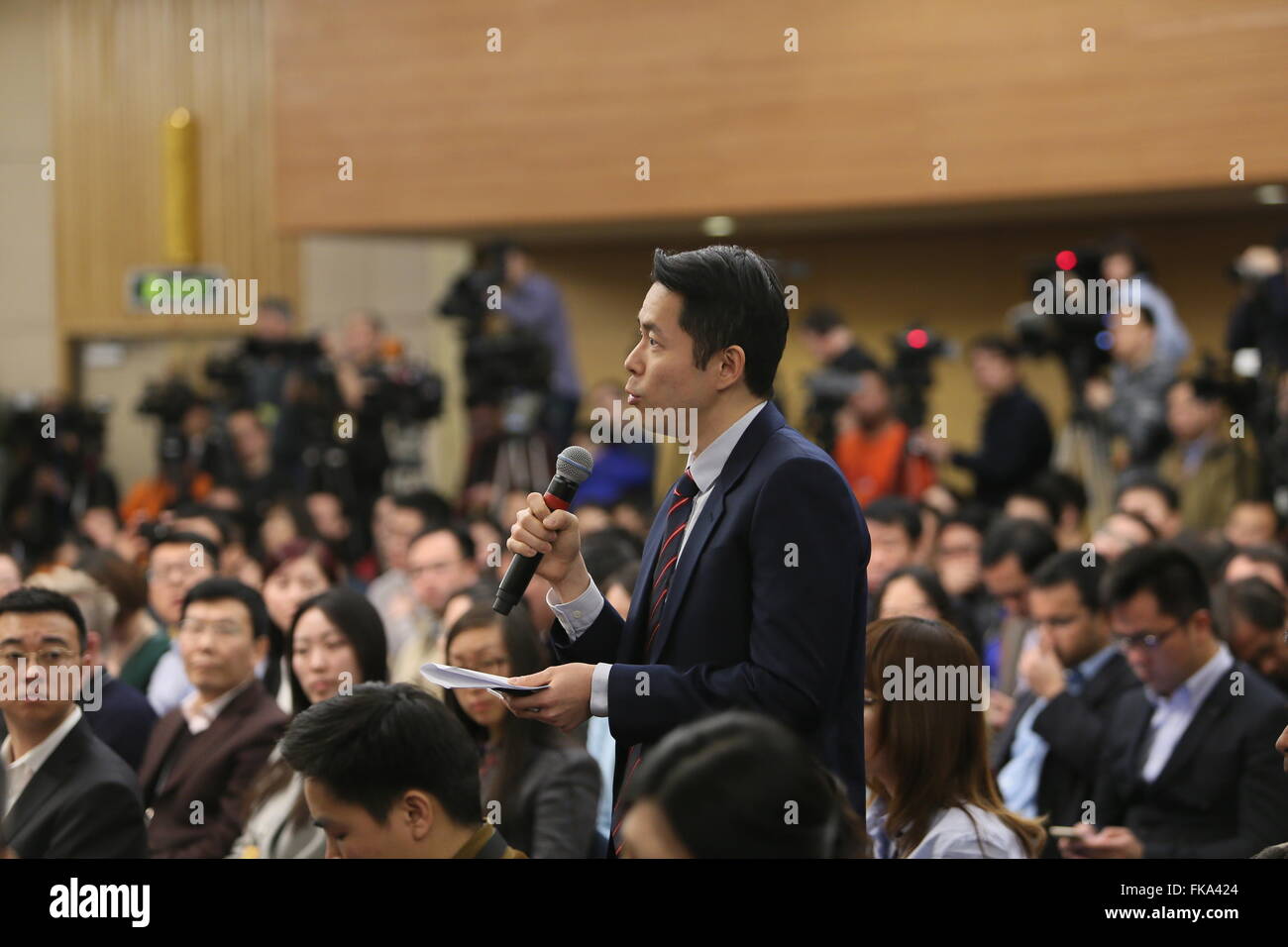 Beijing, China. 8th Mar, 2016. A journalist asks questions during a ...