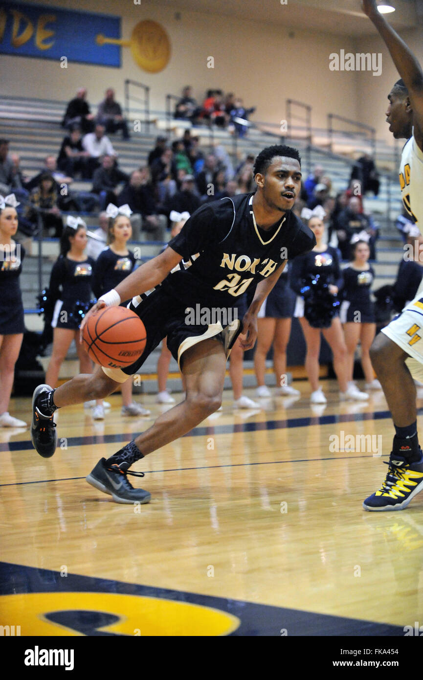 A forward driving on opponents basket while attempting to negotiate ...