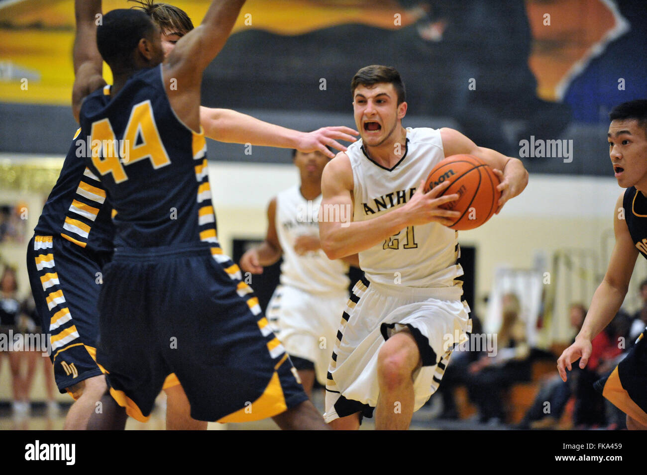 A forward driving on opponents basket while attempting to negotiate ...