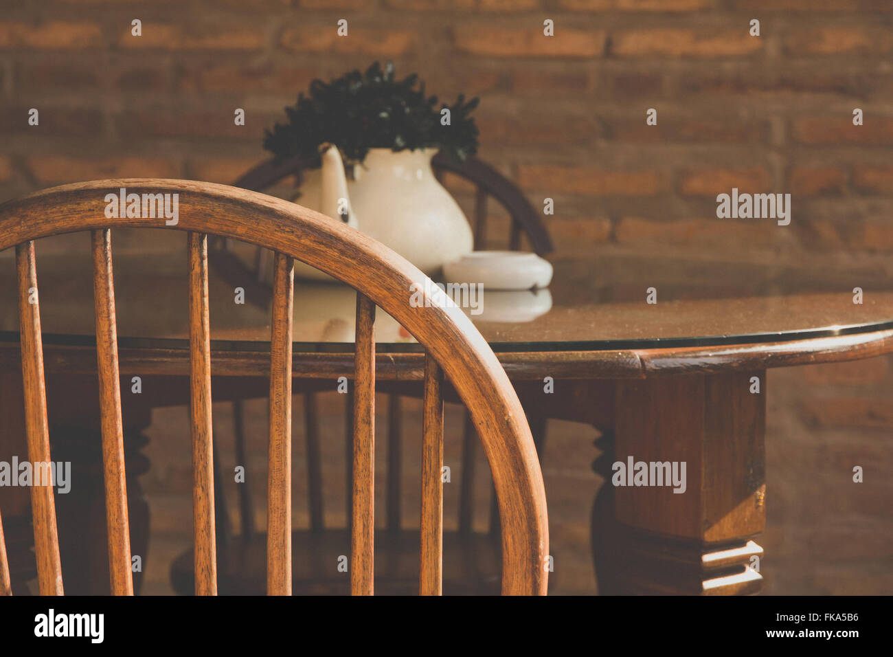 vintage chair and table with flower Stock Photo - Alamy