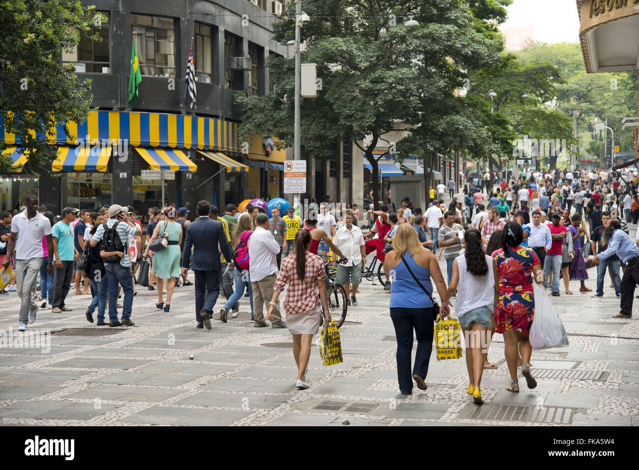 Pedestrians on the sidewalk of November fifteenth street - city center ...