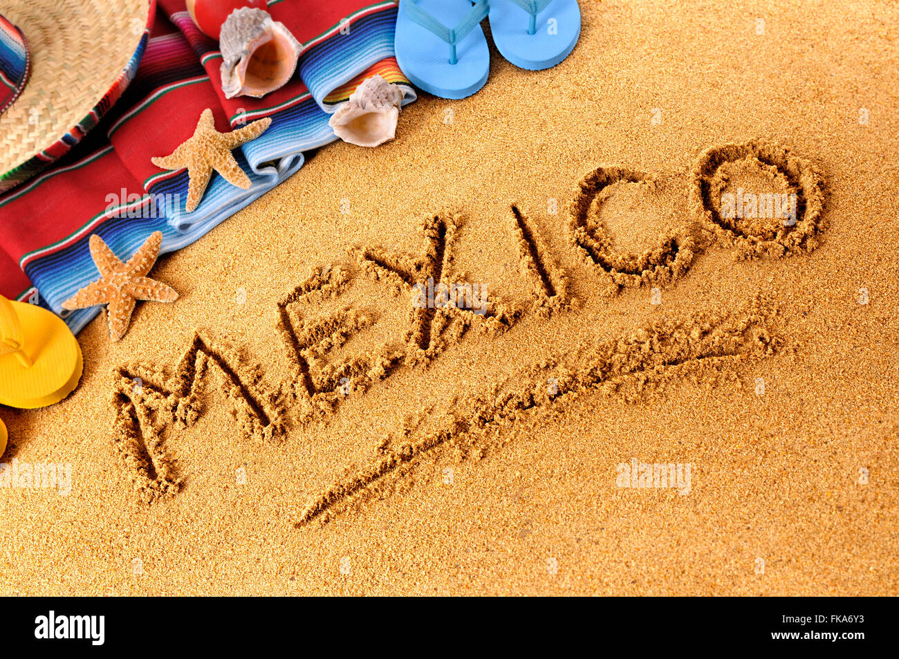 Word cancun written in sand hi-res stock photography and images - Alamy