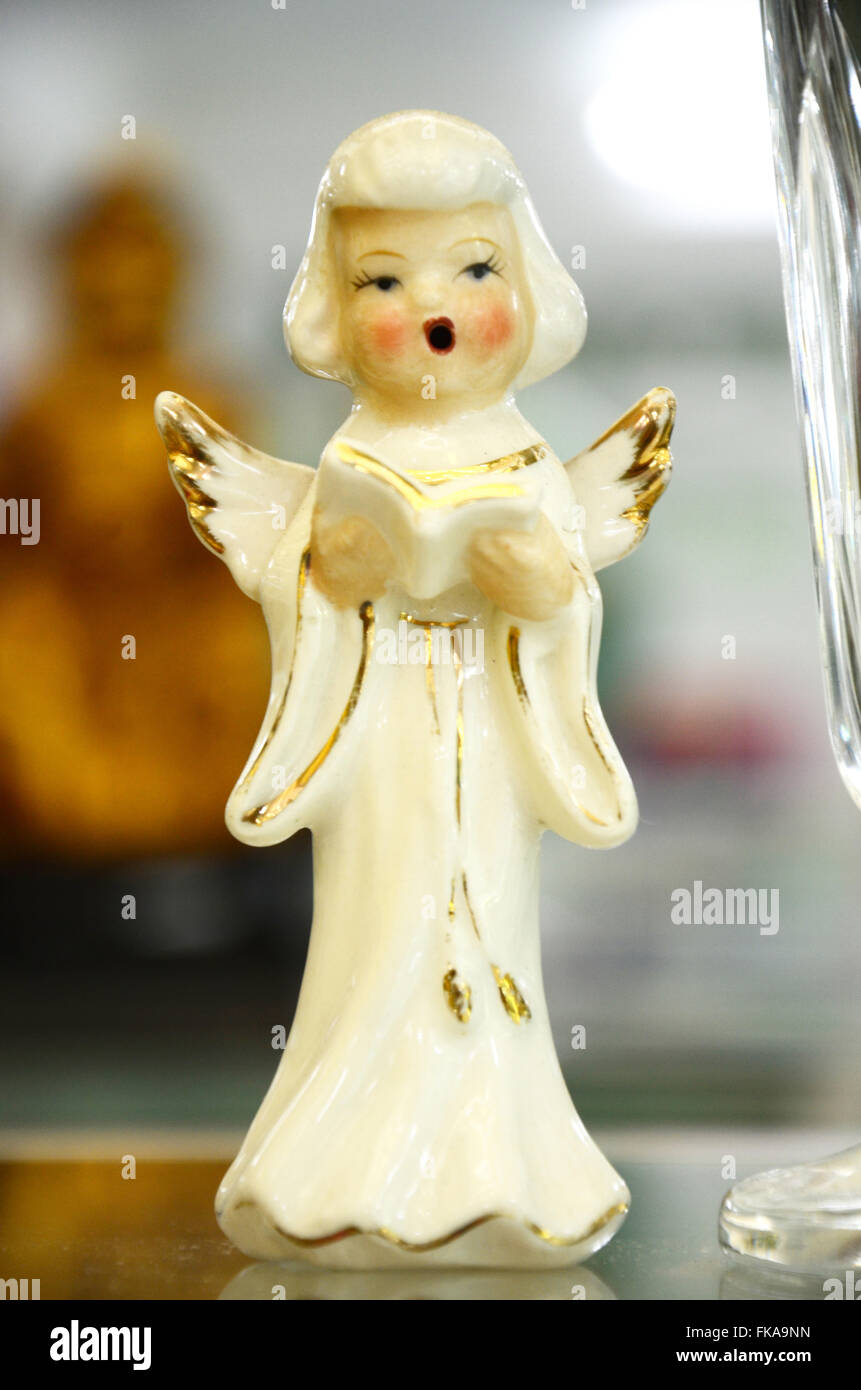 Figure little angel reading bible book Stock Photo - Alamy