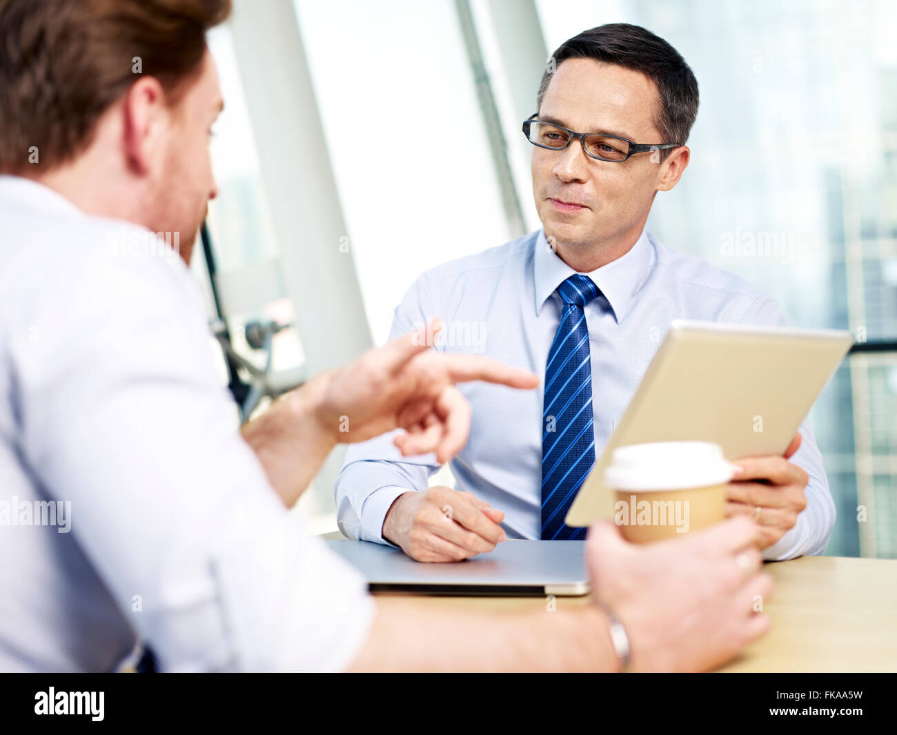 caucasian corporate people having a discussion in office Stock Photo ...