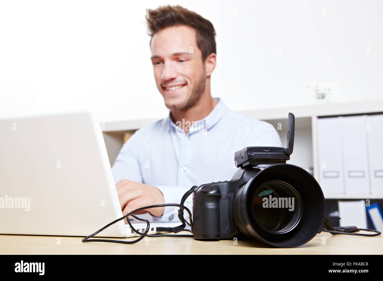 Data transfer with USB cable from digital camera to laptop computer ...