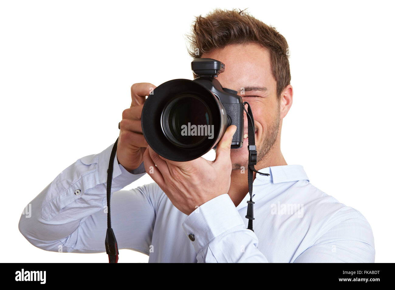 Professional photographer taking pictures with digital DSLR camera ...