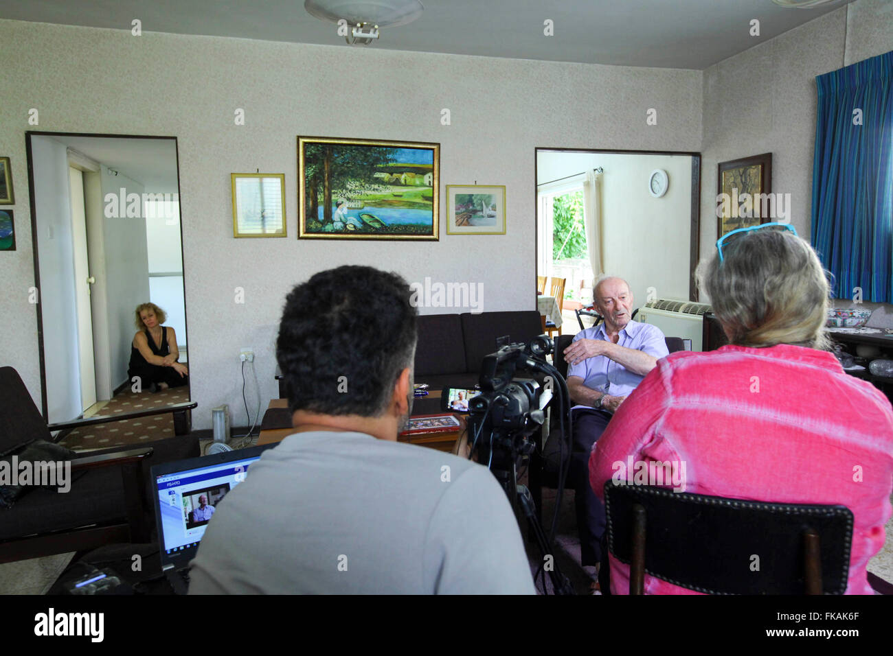 86 years old Avraham Avraham is being interviewed infront of a video ...