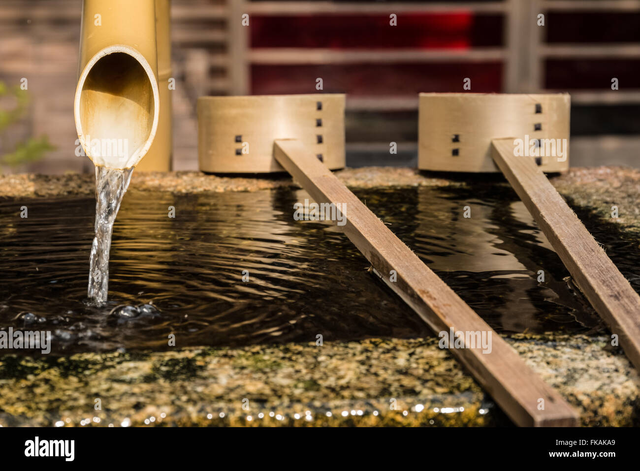 Water basin and purification ladles at Shinto temple in Kyoto, Japan ...