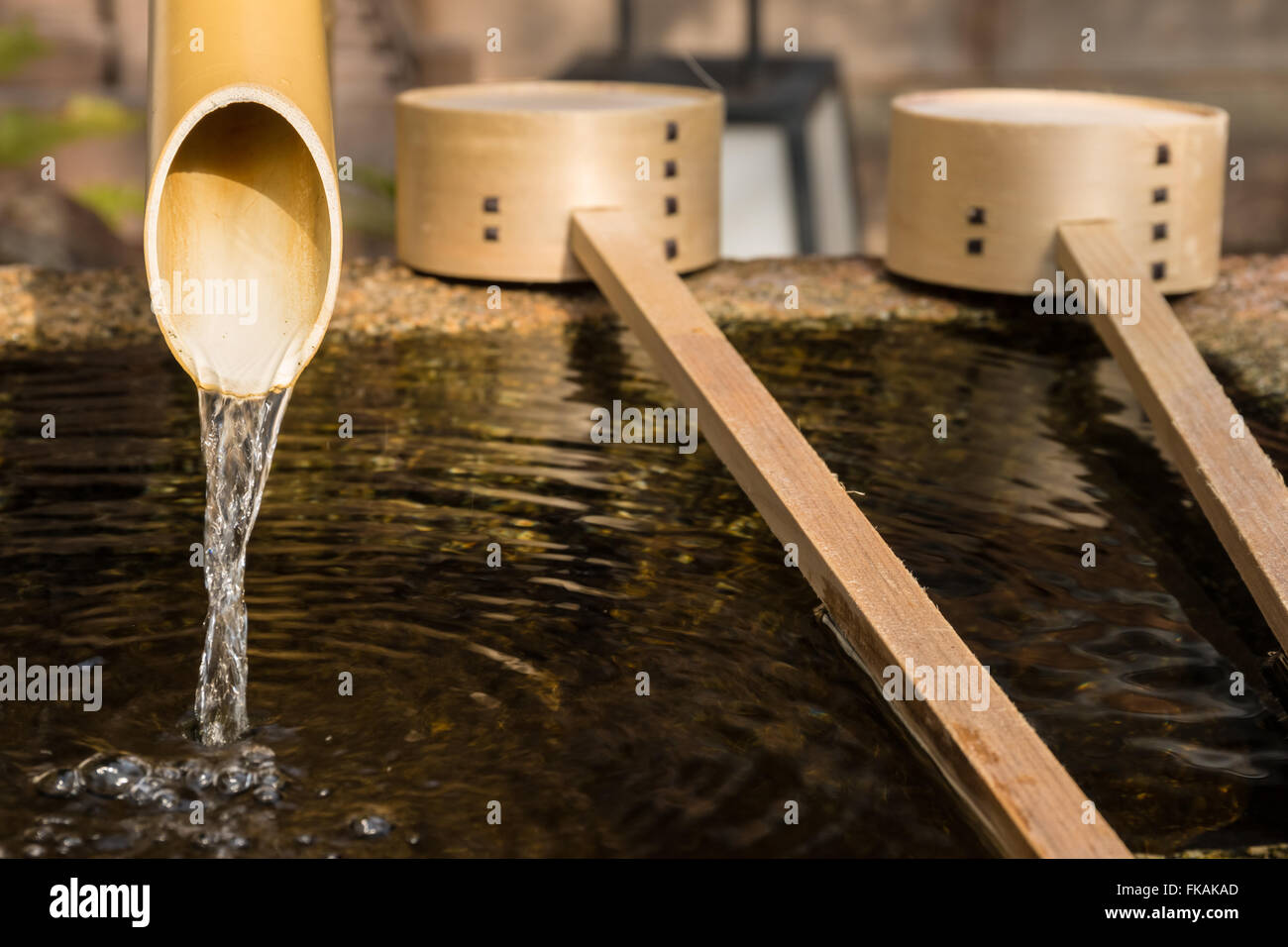 Water basin and purification ladles at Shinto temple in Kyoto, Japan ...