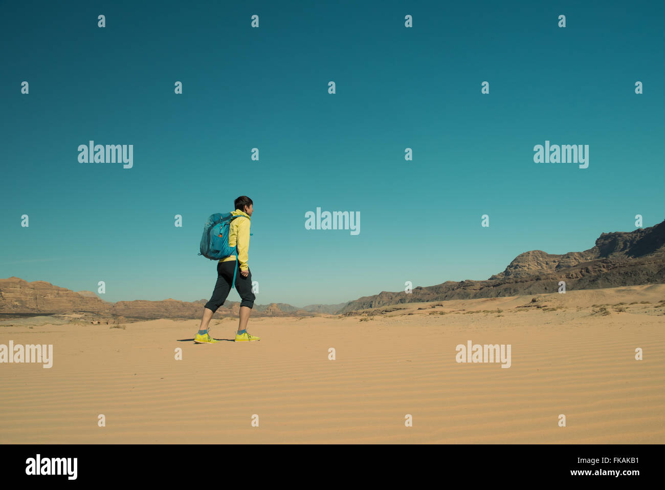 Woman Hiker with backpack enjoy view in desert Stock Photo - Alamy