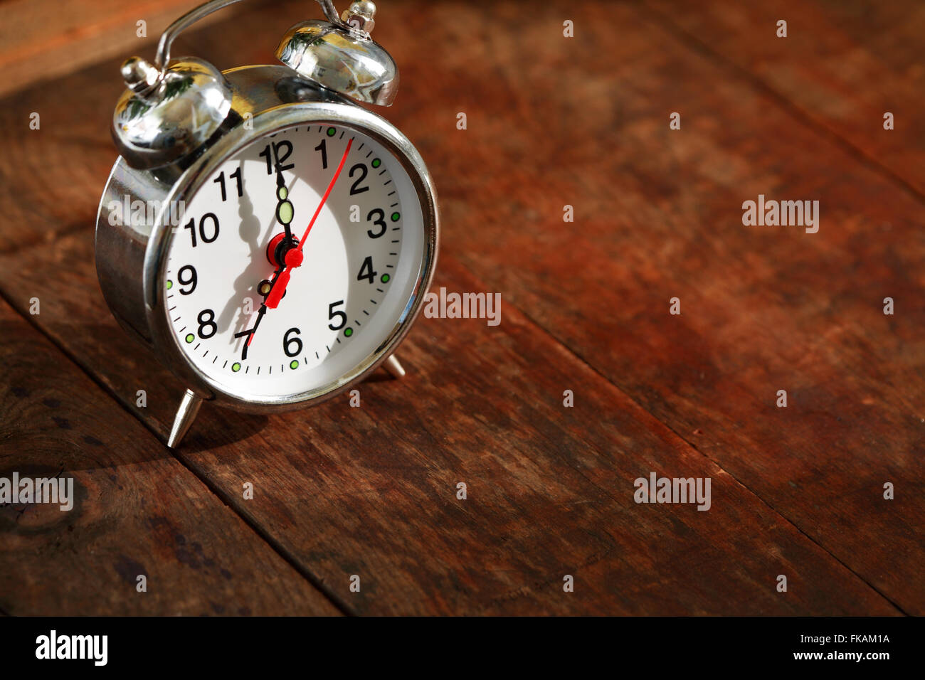 Awakening symbol. Alarm clock closeup on nice old wooden background ...