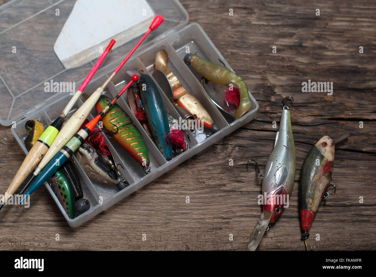 Fishing tackle and bait, on wooden background Stock Photo - Alamy
