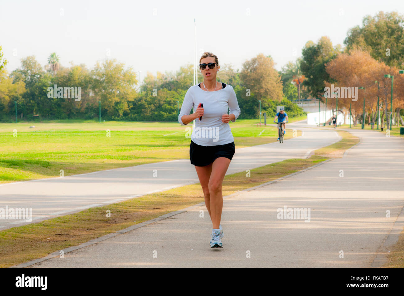 Woman jogs park hi-res stock photography and images - Alamy