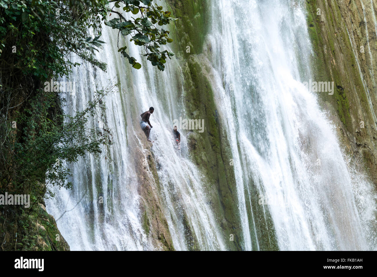 young men jumping into the waterfall Salto El Limon in Limon near Las ...