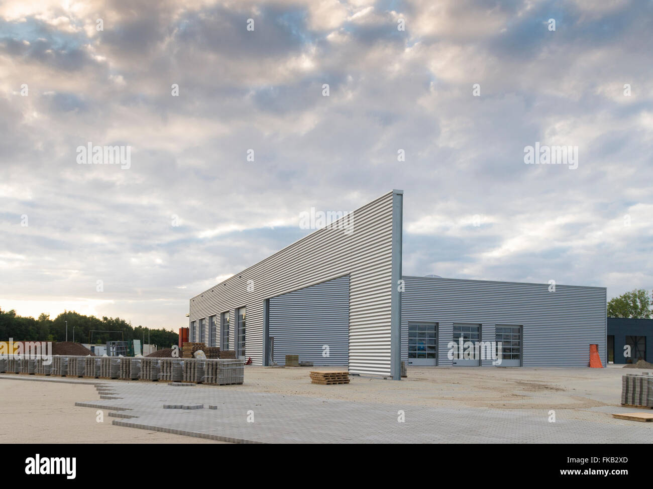 unfinished industrial warehouse in evening light Stock Photo - Alamy