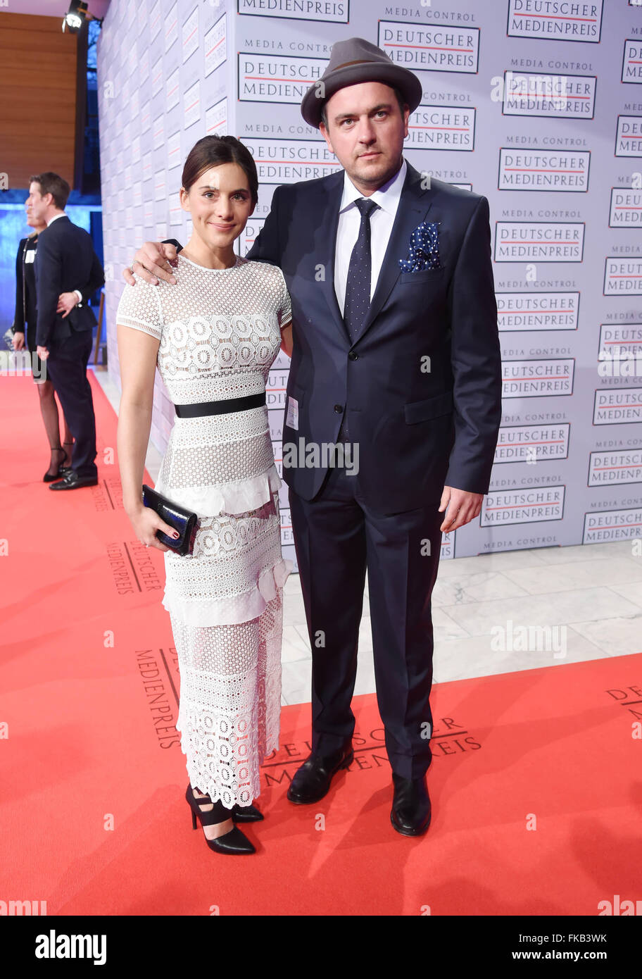 Baden-Baden, Germany. 07th Mar, 2016. Artist Stefan Strumbel (R) and a female companion arrive ...