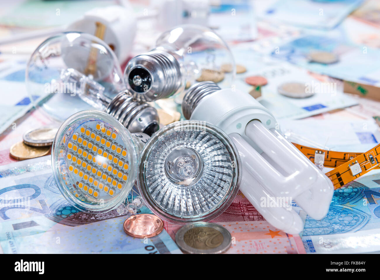 Light Bulbs on european banknotes (close-up shot Stock Photo - Alamy