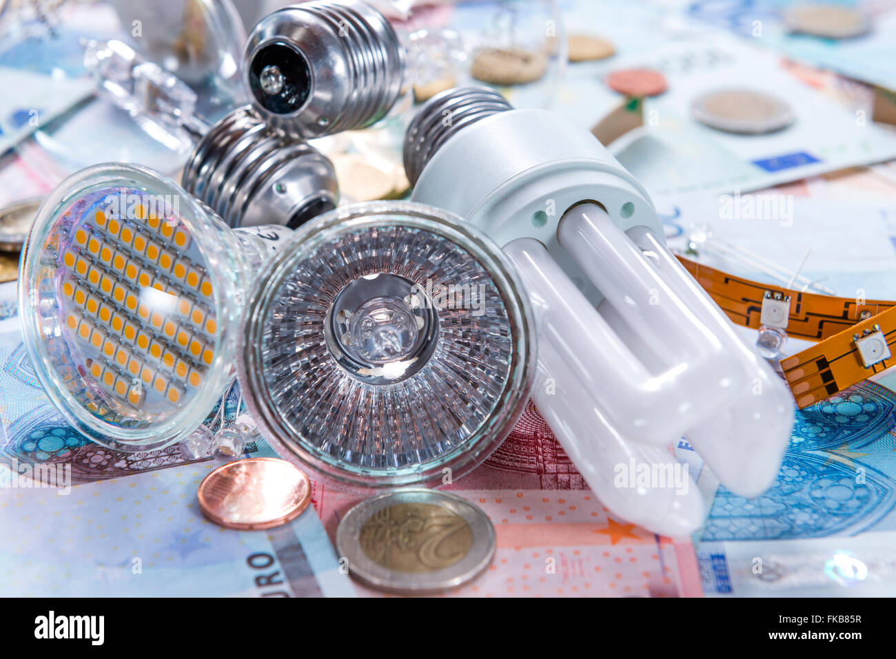 Light Bulbs on european banknotes (close-up shot Stock Photo - Alamy