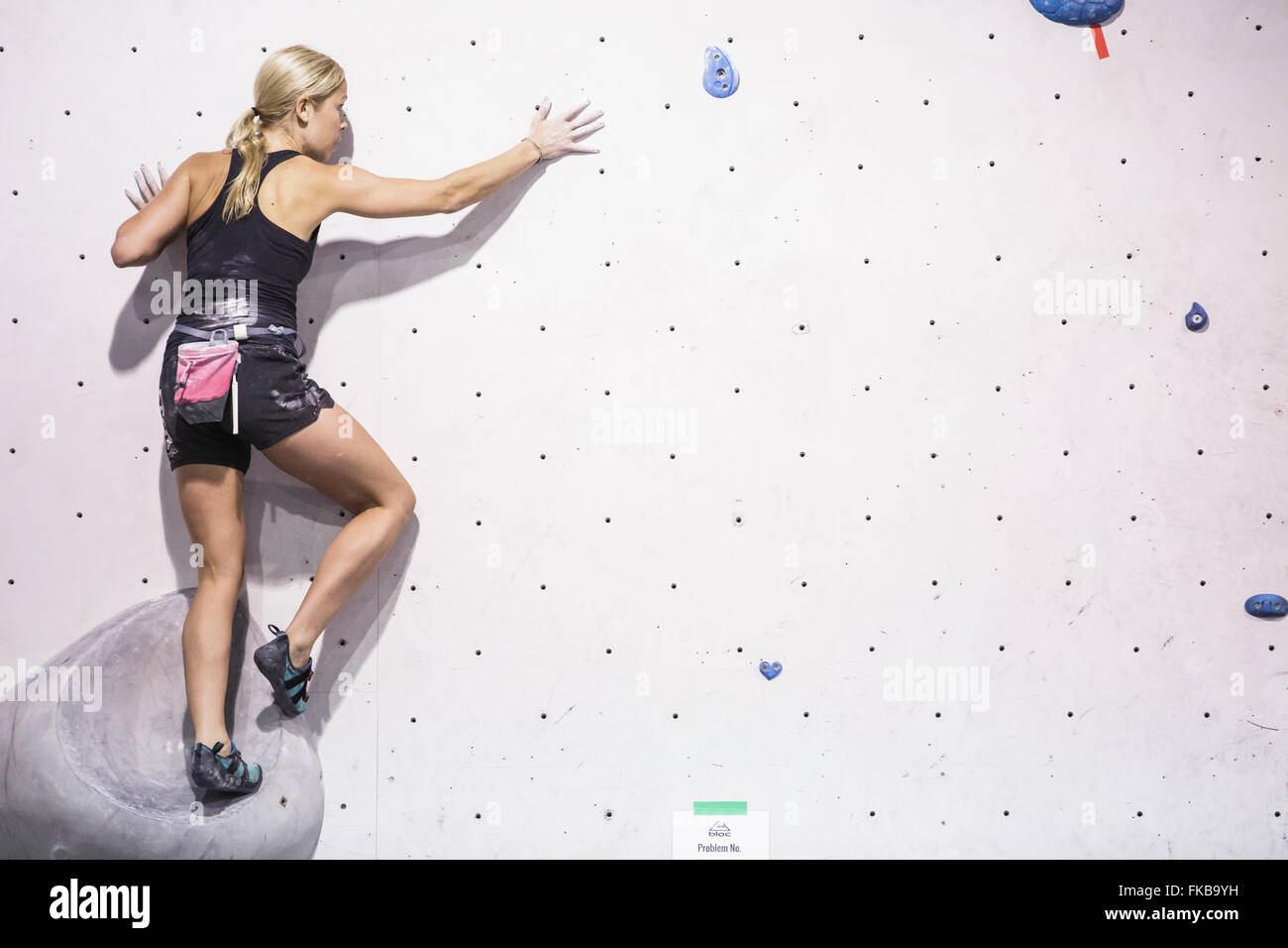 Climbers take part in a bouldering competition at Bloc climbing centre ...