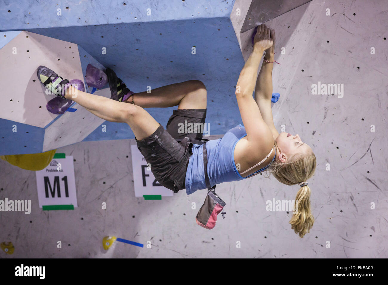 Climbers take part in a bouldering competition at Bloc climbing centre ...