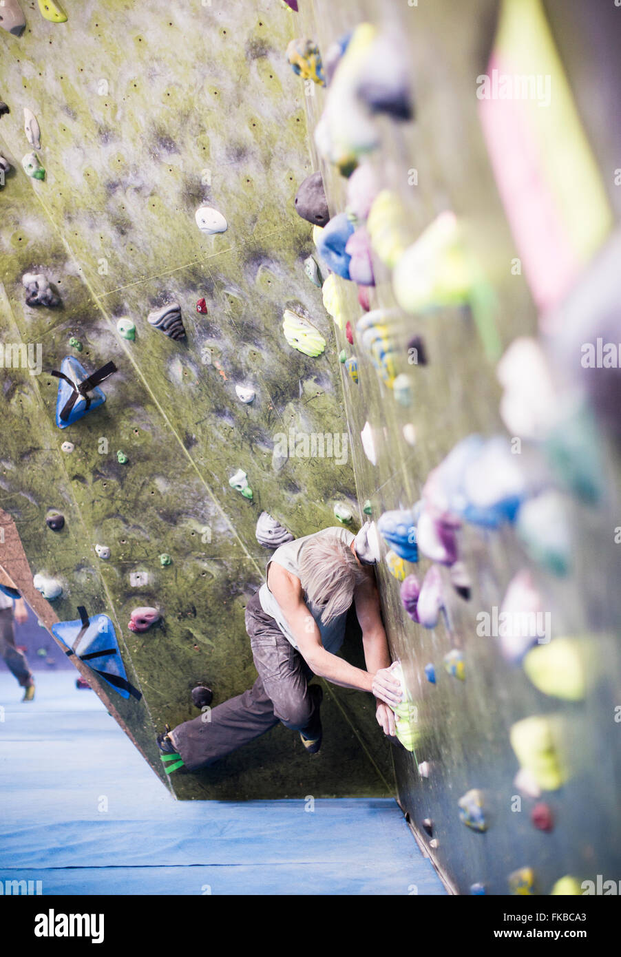 Climbers take part in a bouldering competition at The Climbing Academy ...