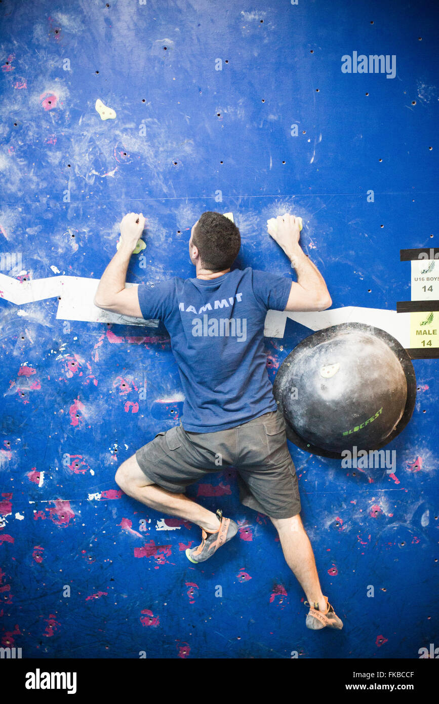 Climbers take part in a bouldering competition at The Climbing Academy ...