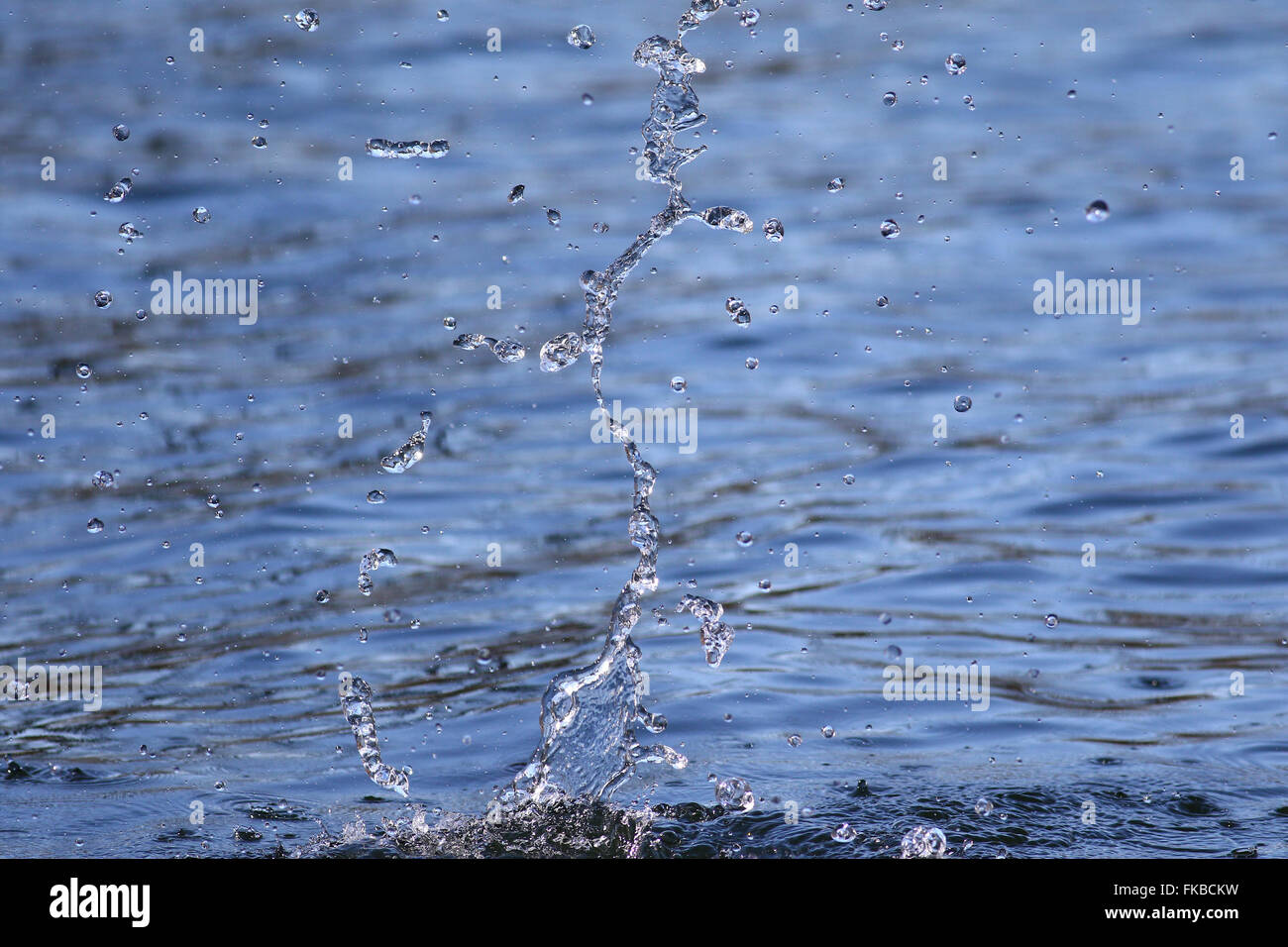 Blue water splash background Stock Photo - Alamy