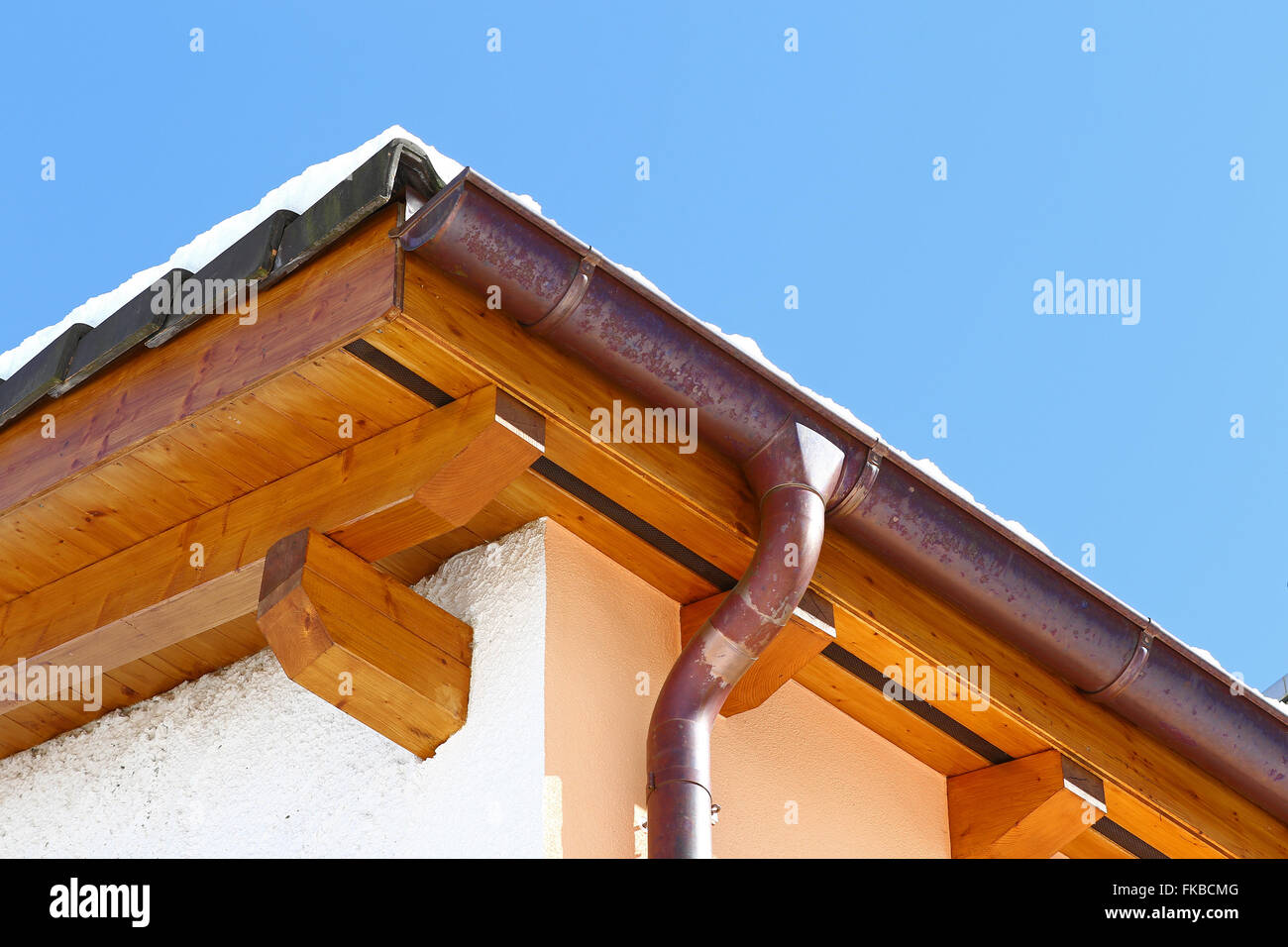 New roof top detail with ceramic tiles and copper water gutter with ...