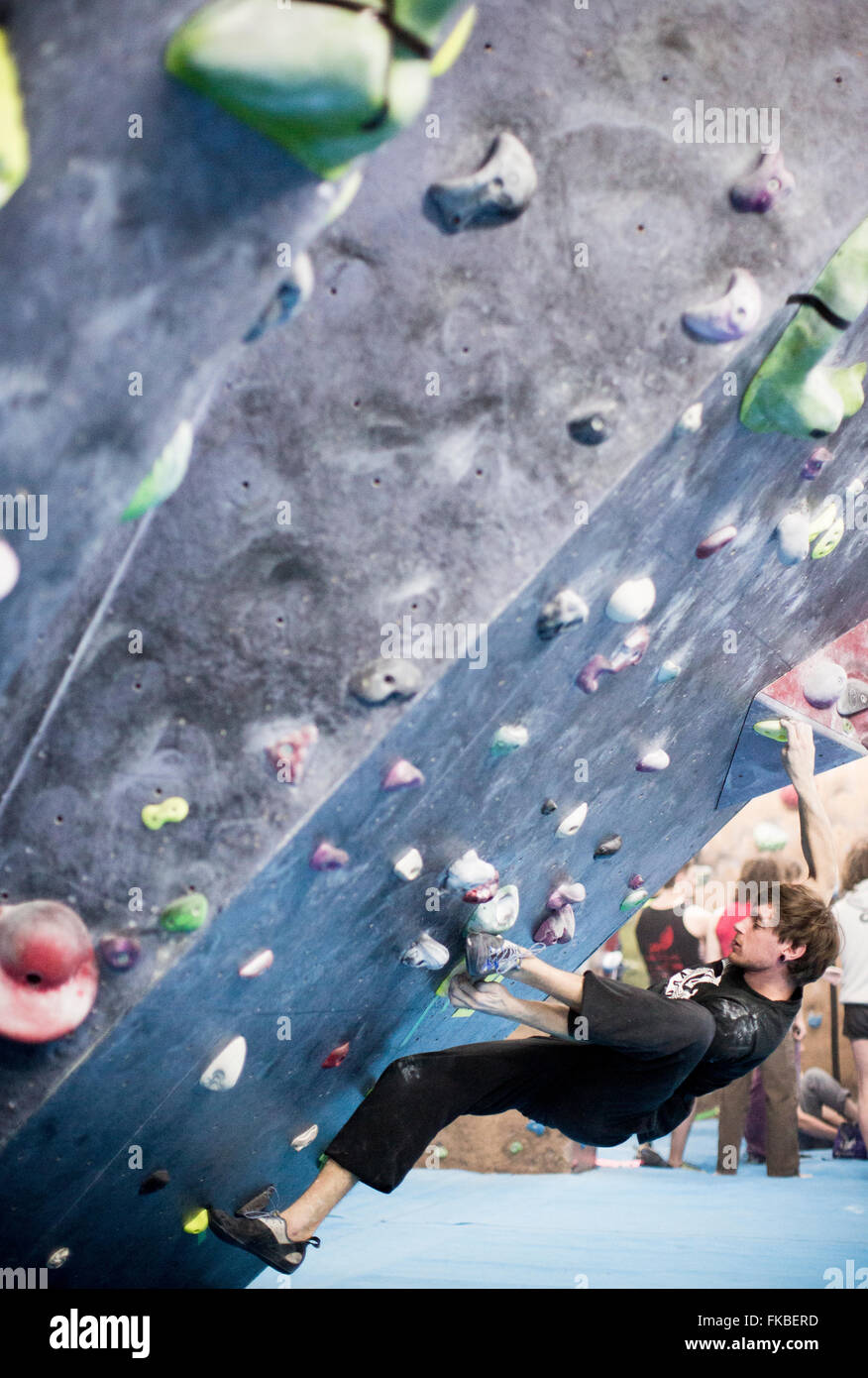 Climbers take part in a bouldering competition at The Climbing Academy ...