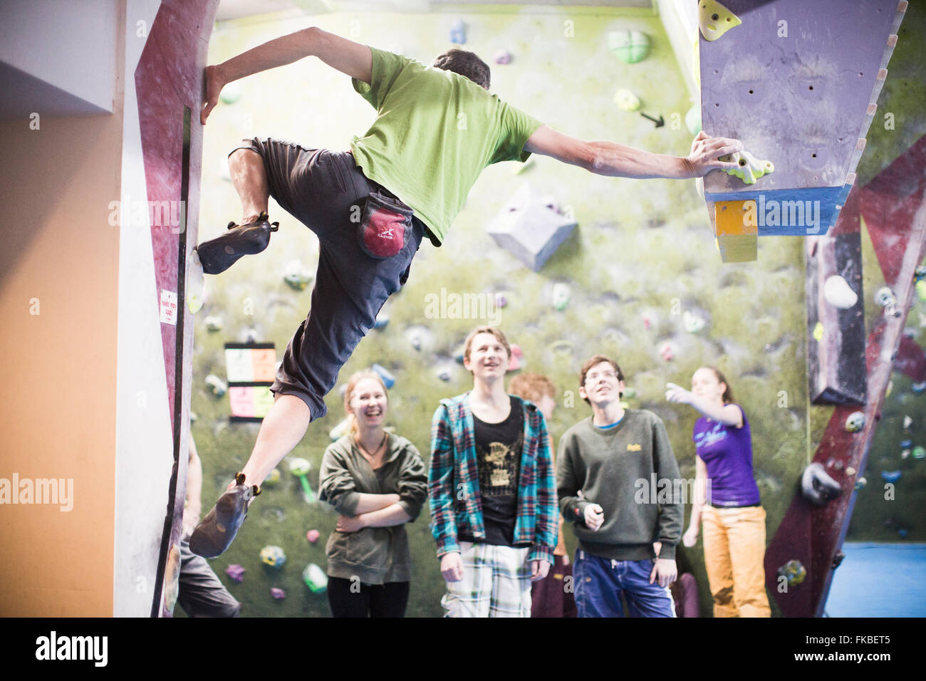 Climbers take part in a bouldering competition at The Climbing Academy ...