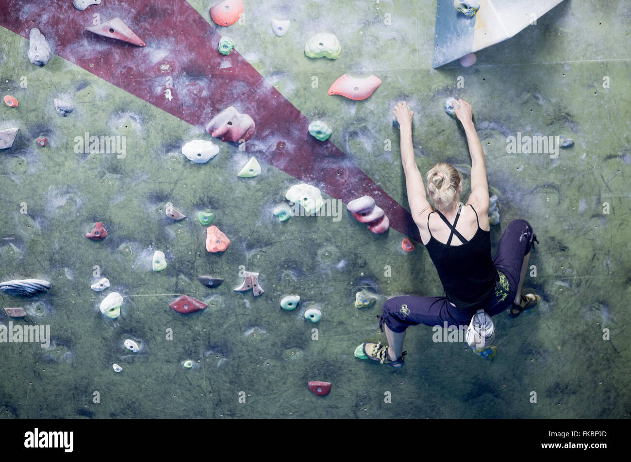 Climbers take part in a bouldering competition at The Climbing Academy ...