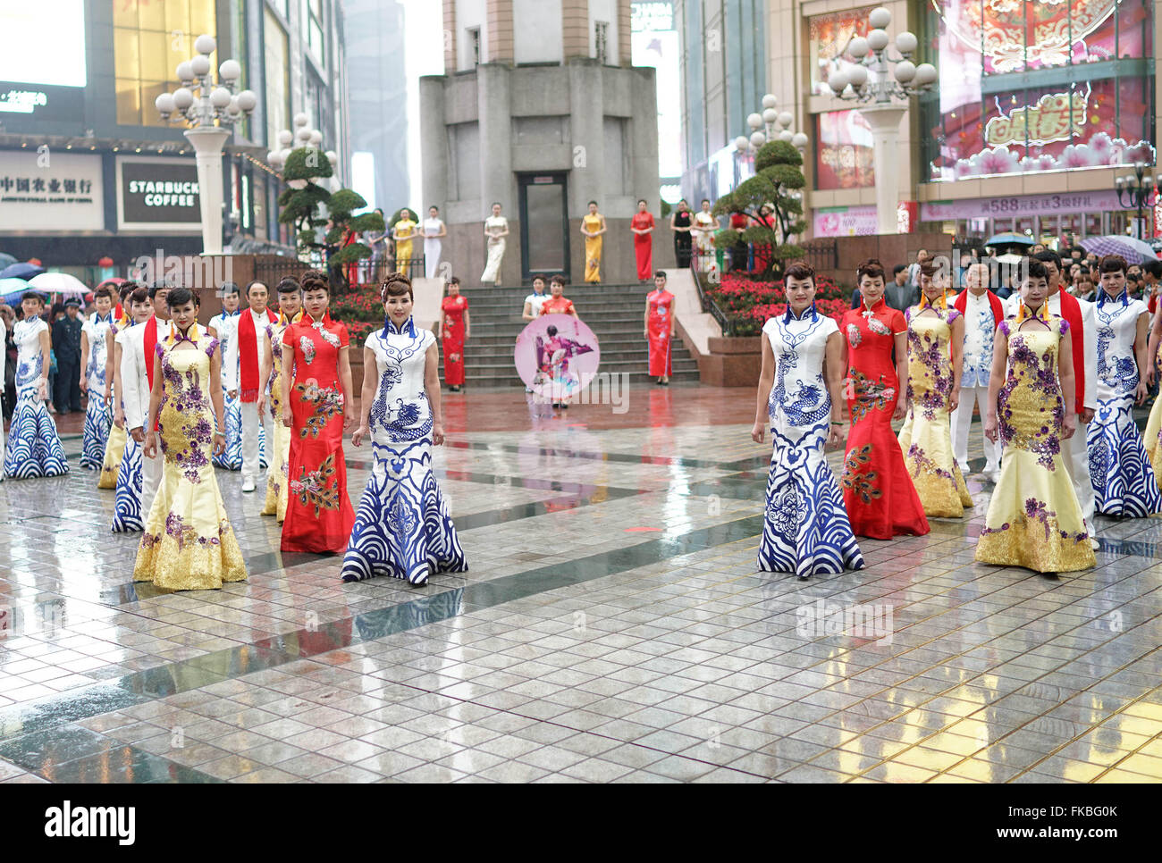 Chongqing, China. 8th Mar, 2016. Women wearing self-made cheongsam put ...