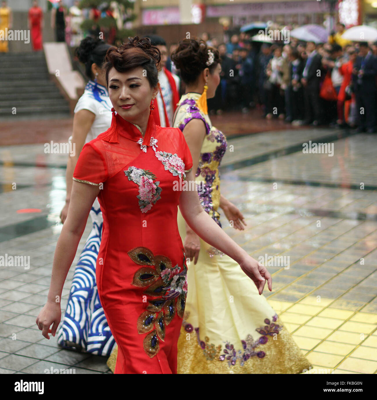 Chongqing, China. 8th Mar, 2016. Women present self-made cheongsam ...