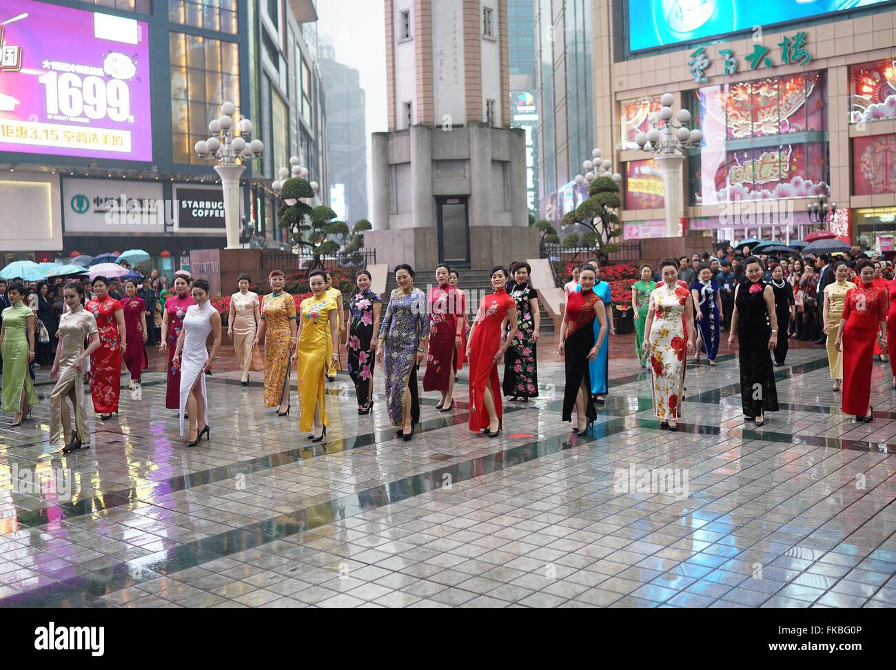 Chongqing, China. 8th Mar, 2016. Women wearing self-made cheongsam put ...