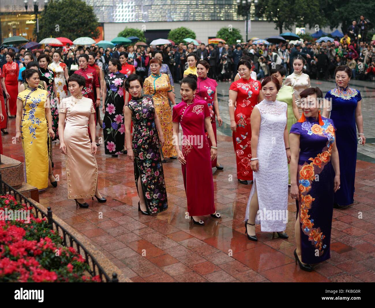 Chongqing, China. 8th Mar, 2016. Women present self-made cheongsam ...