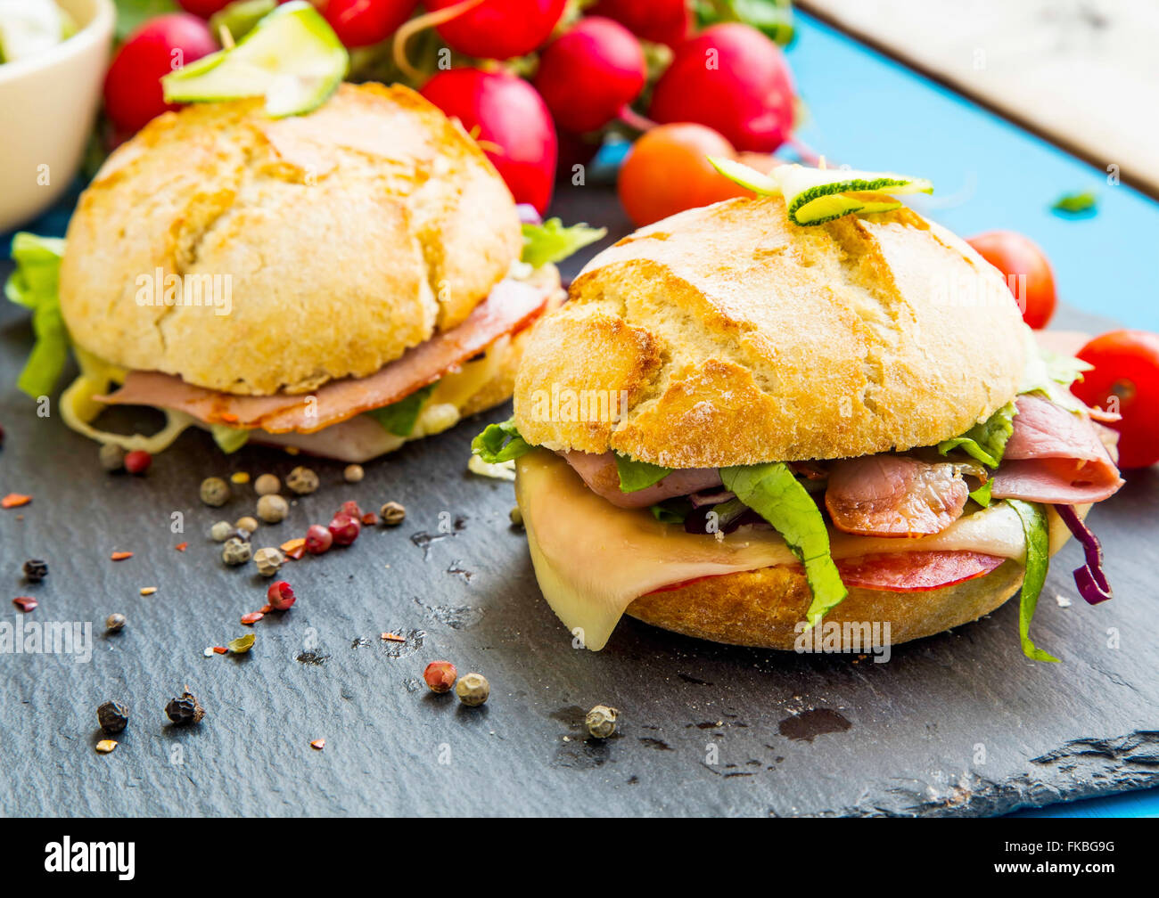 Rustic sandwiches with bacon, salad and cheese Stock Photo - Alamy