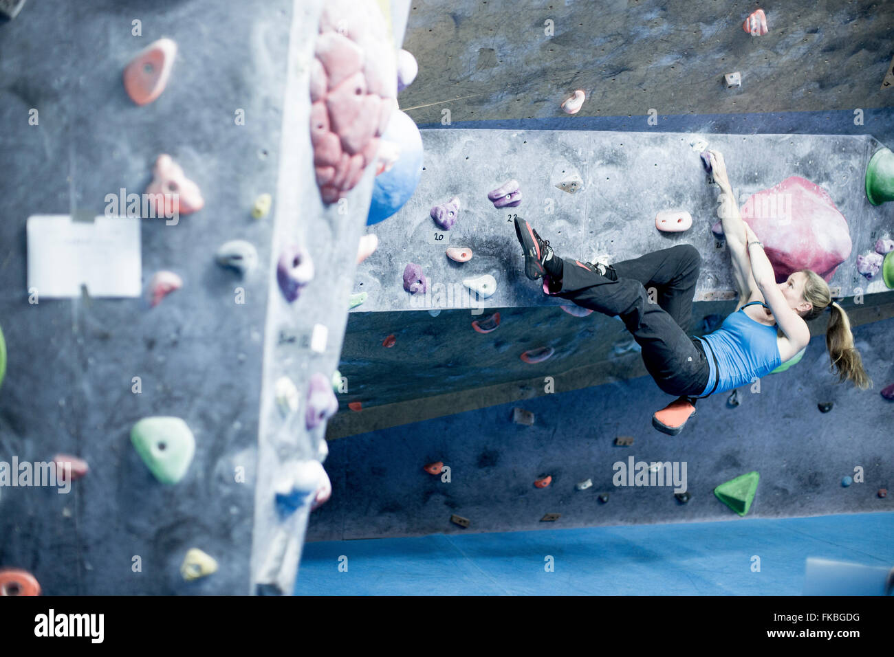Climbers take part in a bouldering competition at The Climbing Academy ...