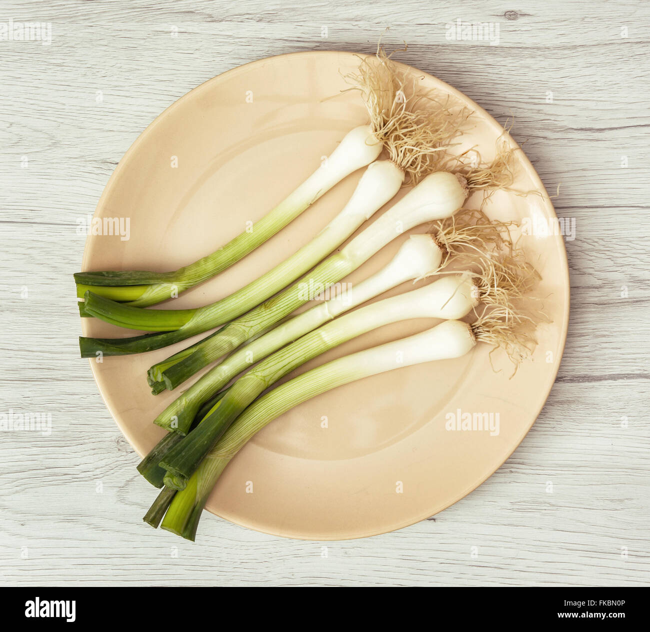Scallions on the plate. Food theme. Healthy lifestyle Stock Photo - Alamy