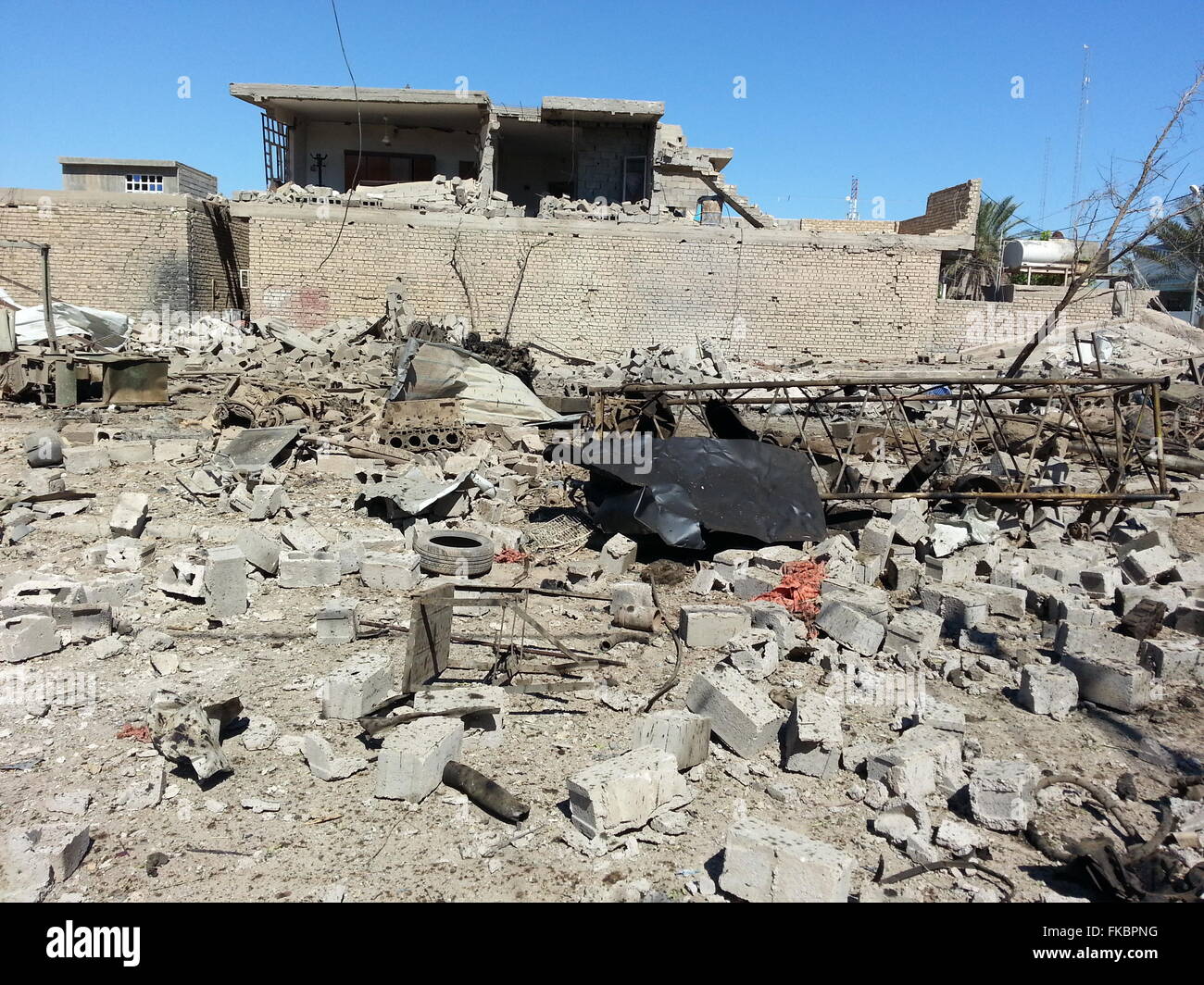 Fallujah, Iraq. 8th Mar, 2016. Debris of a destroyed building is seen ...
