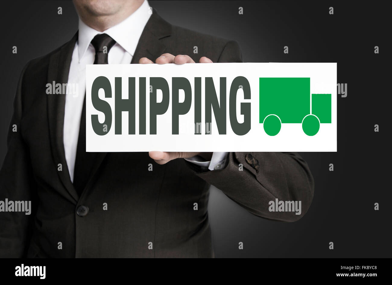 shipping sign is held by businessman background Stock Photo - Alamy