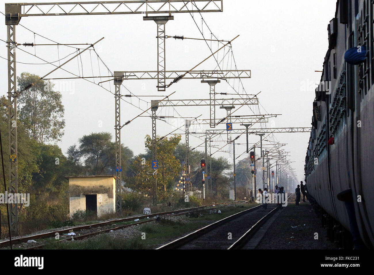 Railway tracks overhead electric poles hi-res stock photography and ...